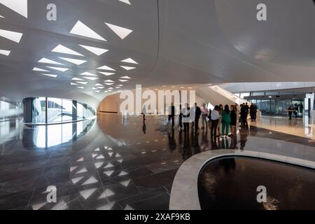 People standing in the main reception area. BEEAH Headquarters, Sharjah ...