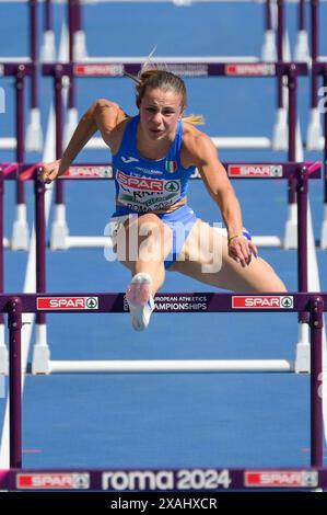 Italy's Elena Carraro competes in a women's 100 meters hurdles heat at ...