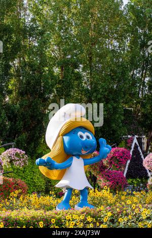 A large Smurf statue with blonde hair in Smurfs Village in Dubai ...