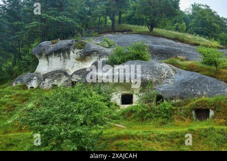 Big old cave houses from outside, rainy weather Stock Photo - Alamy