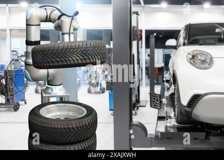 Robot arm works in a car service Stock Photo - Alamy