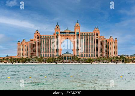 Tourists at The Pointe viewpoint, view to Atlantis The Palm hotel ...