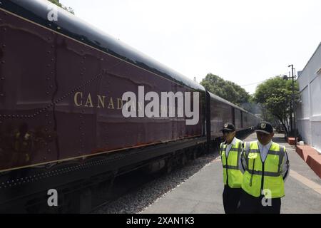 Final Spike Steam Tour police officers walk next to the Empress 2816 ...