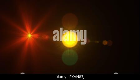 Image of yellow light and red star moving on black background Stock ...