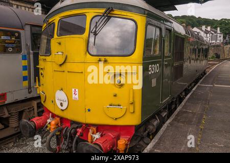 A restored Class 26 diesel locomotive with passengers at the Llangollen ...
