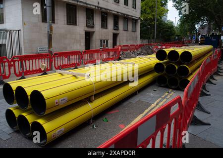 Huge new pipes awaiting installation on a road in London Stock Photo ...