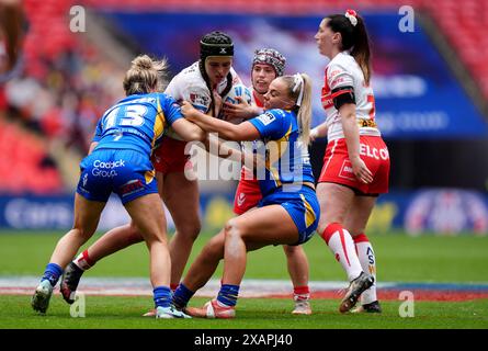 Leeds Rhinos' Bethan Dainton (centre) is tackled during the Betfred ...
