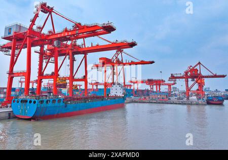 RUGAO, CHINA - JUNE 8, 2024 - Cargo ships work at the berth of Suzhong ...