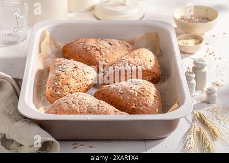 Hot and healthy triangular rolls baked in the bakery. Triangular rolls ...