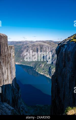 A picturesque view of the Kjeragbolten cliff in Norway, showcasing the ...