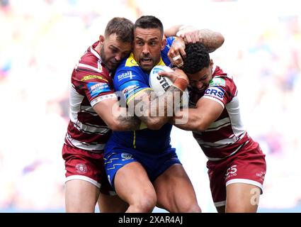 Paul Vaughan of Warrington Wolves is tackled during the Betfred Super ...
