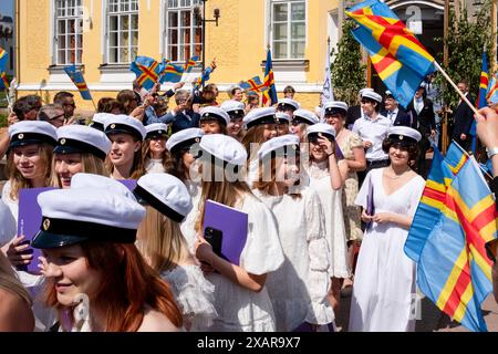 The new graduates emerge from their school for the final time to a ...