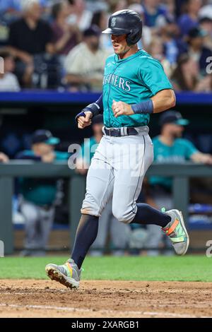 Seattle Mariners third baseman Dylan Moore throws to first base but ...