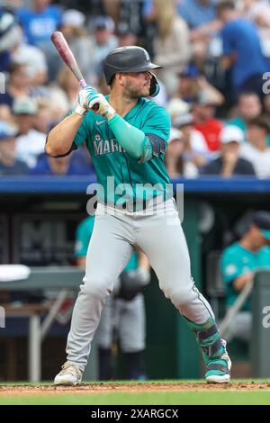 Seattle Mariners first baseman Ty France blows a bubble as he covers ...