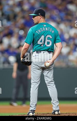 Seattle Mariners pitcher Trent Thornton goes to the ground with an ...