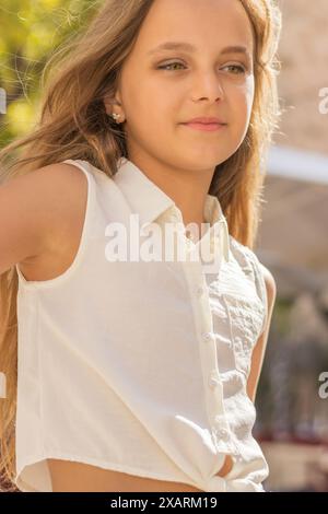 This image is a heartwarming portrait of an 11-year-old girl, capturing a moment of pure joy and ...