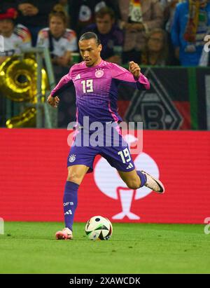 Leroy Sane #19 of Germany drives the ball forward during the 2026 FIFA ...