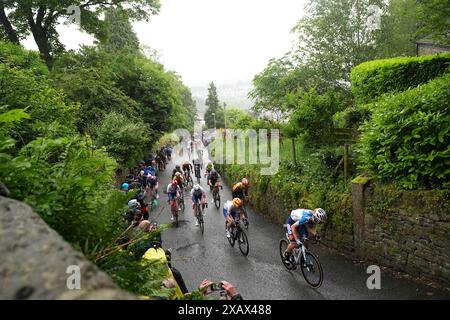 Riders heading up The Rake hill climb in Ramsbottom during stage four ...