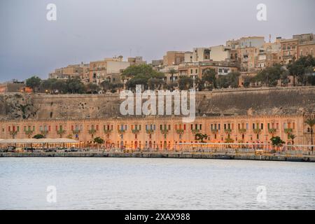 Tipical house wall in Malta. Limestone yellow bricks and colorful ...
