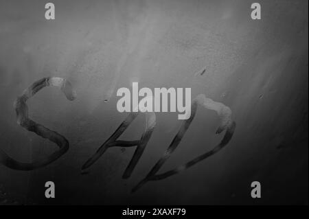 Word sad written on foggy window with rain drops Stock Photo - Alamy