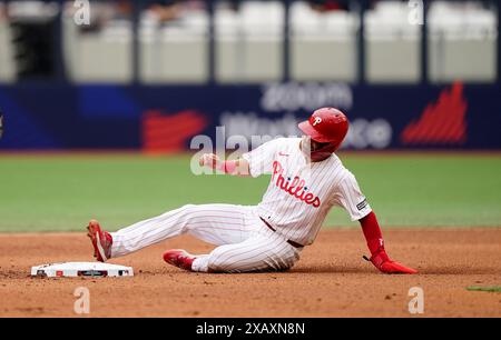 Philadelphia Phillies' Whit Merrifield slides in as he attempts to ...