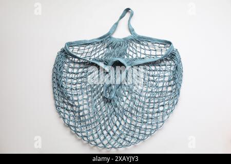Blue string bag on light grey background, top view Stock Photo - Alamy