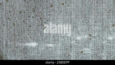 Texture fabric of jeans background is contaminated dirty with stains ...