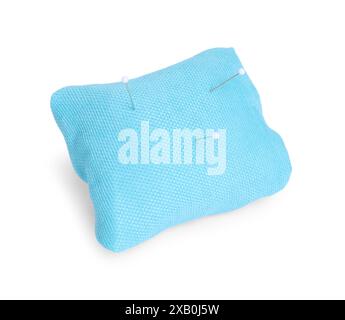 Light blue pincushion with sewing pins and threads isolated on white ...