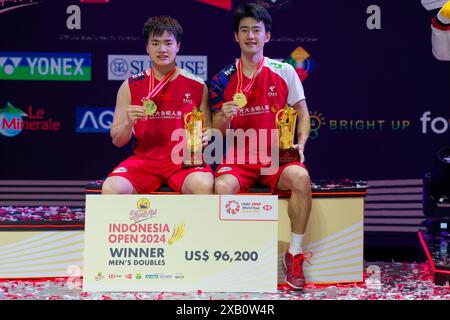 Liang Wei Keng (R) and Wang Chang of China play against Marcus Fernando Gideon and Kevin Sanjaya ...