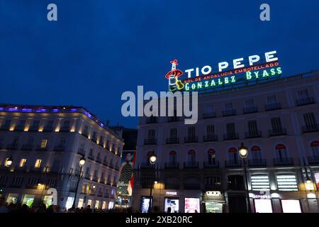 Madrid, Spain- April 8, 2024: Tio Pepe sign at night in Puerta del Sol ...