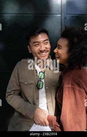 A multiethnic couple, composed of a Chinese man and a Hispanic woman ...