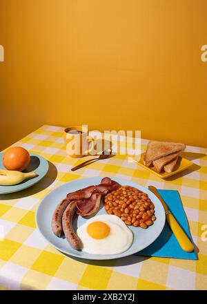 Yellow coloured Tablecloth with a delicious full English Breakfast, egg ...