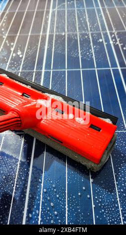 Cleaning dirty solar panels. Maintenance Stock Photo - Alamy