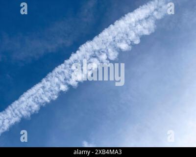 Dissipating contrail high thin cloud artificially created by aircraft ...