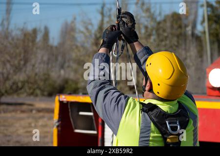 Firefighter, secure rope to lift stretcher Stock Photo - Alamy