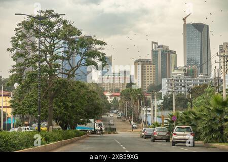 Road full of cars and rapidly developing downtown of central business ...