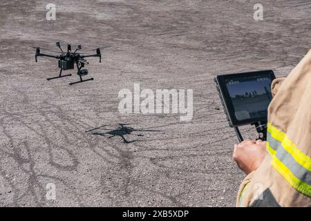 A firefighter flying a rescue drone Stock Photo - Alamy