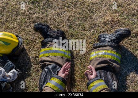 Wet firefighters resting during rescue tasks Stock Photo - Alamy