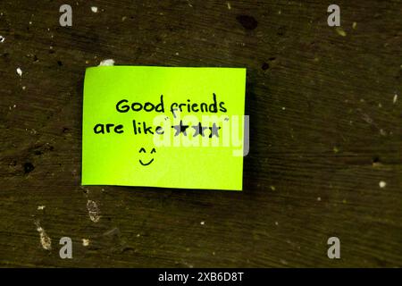 sticky notes with garden background, national friendship day concept ...