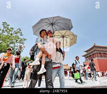 Tourists visit the Palace Museum amid hot weather in Beijing, China, 25 ...