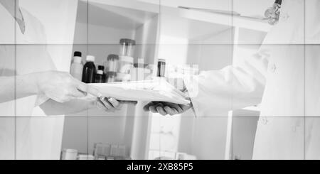 Medical assistant handing folders to the doctor in medical office ...