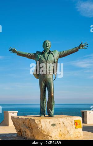 Statue of Domenico Modugno on the lungomare, Polignano a Mare, Italy ...