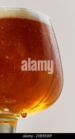 A glass mug filled with amber liquid sits on a wooden surface ...