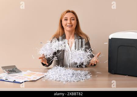 Secretary with shredder on light background Stock Photo - Alamy