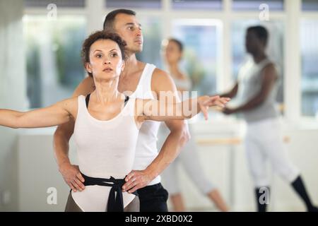 Ballet partners mastering paired technique during group class Stock ...