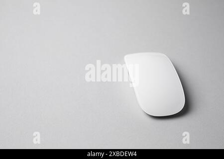 One wireless mouse on grey background, top view. Space for text Stock ...