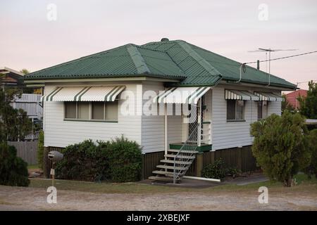 Suburban post war weatherboard house with updated with aluminium ...