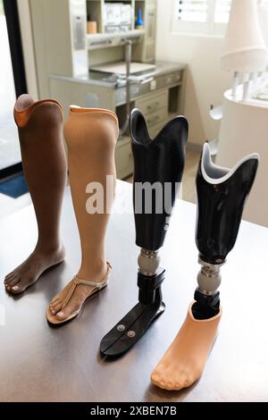 Modern prosthetic lab with various prosthetic limbs displayed on ...