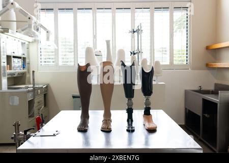 Modern prosthetic lab with various prosthetic limbs displayed on ...