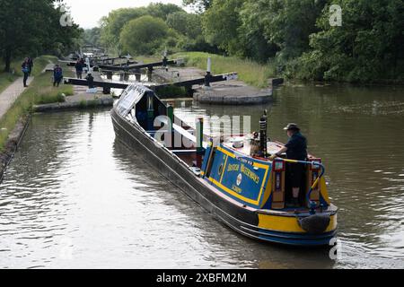 Heritage narrowboat "Scorpio" on the Grand Union Canal at Hatton Locks ...